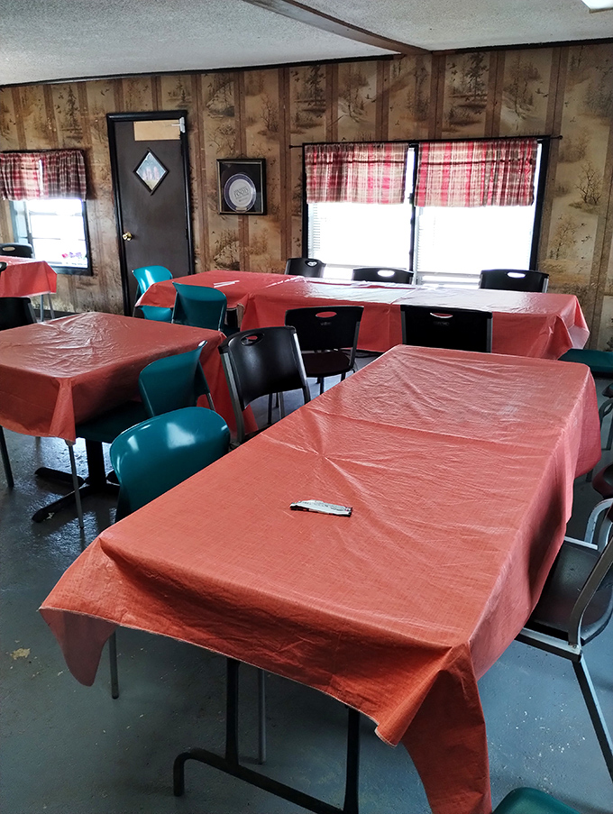 Orange tablecloths and mismatched chairs create the perfect setting for serious eating. No distractions from the main event: that glorious barbecue.