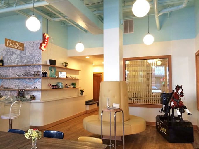 Pale blue walls, globe lights, and a vintage kiddie ride. The interior feels like Wes Anderson designed an ice cream parlor after watching "Happy Days."