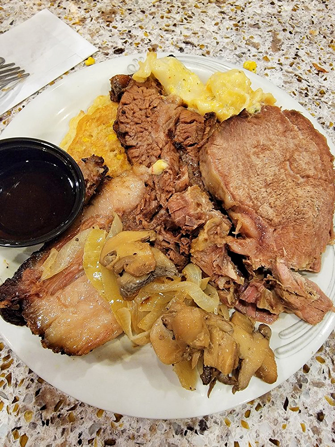 A plate that would make your cardiologist wince but your soul sing&mdash;featuring multiple meats that clearly lived their best lives. 