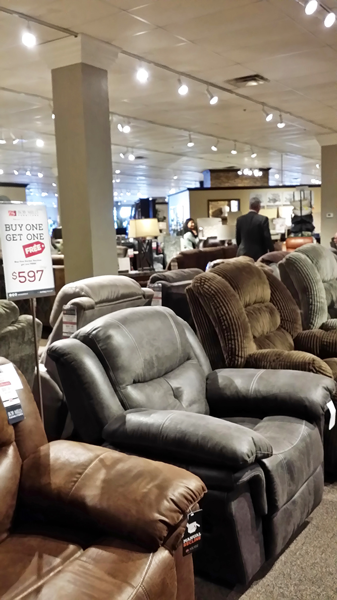 The recliner section: where shoppers come to sit "just for a minute" and end up planning their entire evening entertainment setup.