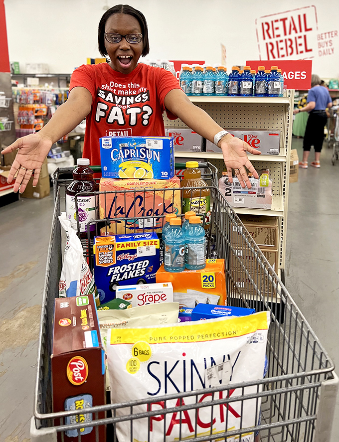 Does this make my SAVINGS fat? Her shirt says it all. That cart full of name-brand groceries probably cost less than a fancy restaurant meal.
