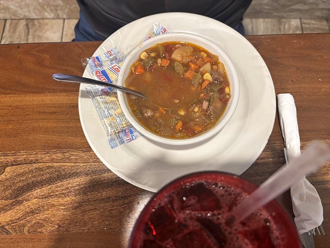 A bowl of vegetable beef soup that looks like it's been simmering since breakfast, gathering flavor with each passing hour. Liquid comfort.