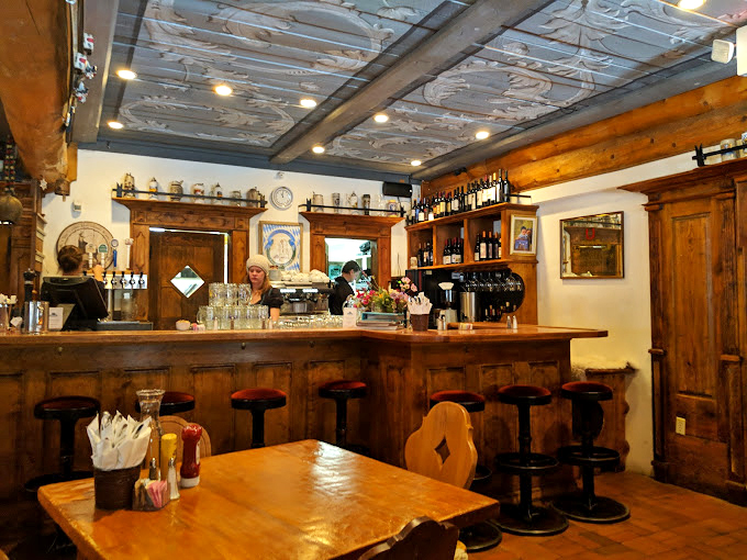 Where rustic charm meets mountain hospitality, the interior feels like stepping into a storybook Bavarian hunting lodge.