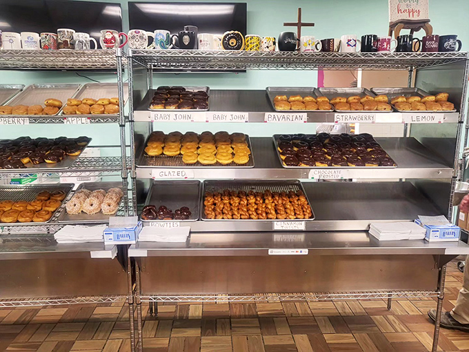 The display case of champions. Each shelf a testament to the art of donut-making&mdash;organized temptation at its finest.