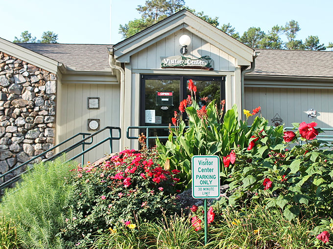 Welcome to discovery central! The visitor center's blooming entrance says "come on in" with more charm than your grandmother's front porch.