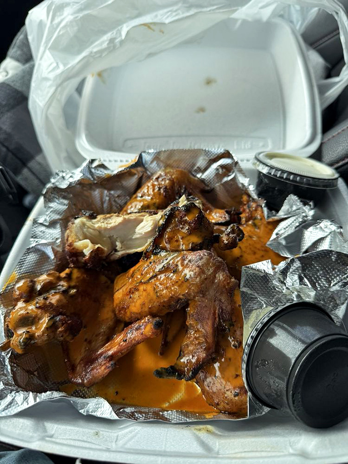 Even takeout wings maintain their dignity. These smoky appendages refuse to be ordinary, even when traveling beyond restaurant walls.
