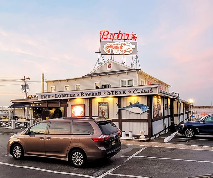 Bahrs Landing's iconic sign glows like a lighthouse for hungry seafood pilgrims. A beacon of deliciousness since 1917!