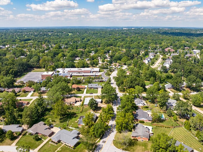Ballwin's tree-canopied neighborhoods create a lush, established feel. From above, you can see how homes nestle comfortably among mature trees&mdash;nature and civilization in harmony.