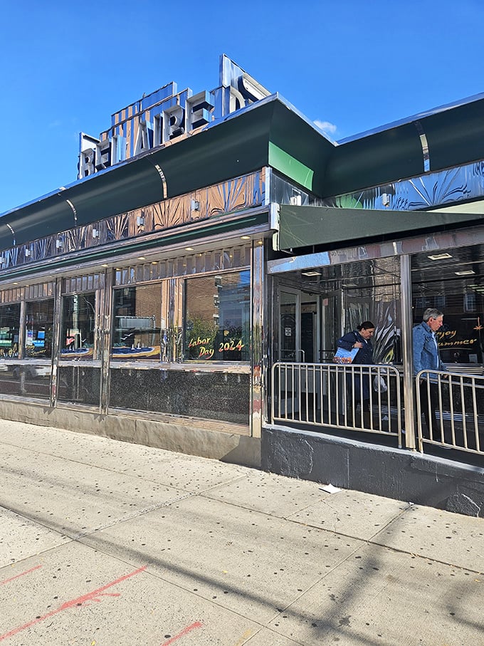Bel Aire's gleaming facade houses breakfast dreams behind a row of potted plants that say, "Yes, we care about details, especially in your omelet."
