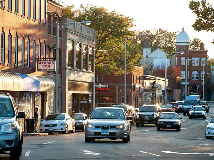 Danbury's downtown glows in golden hour light, where historic buildings and tree-lined streets create a picturesque setting.