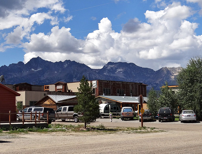 Stanley's rustic buildings stand small against the massive Sawtooth Mountains, a reminder of nature's grand scale.