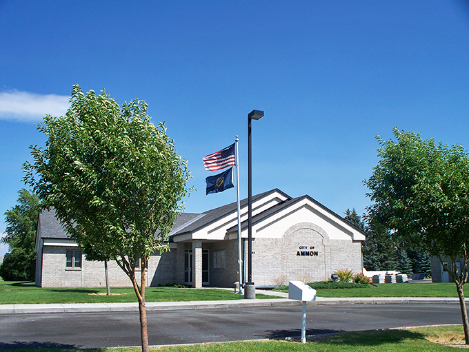 Ammon's City Hall stands proudly with flags flying, representing the town's modern touches while maintaining that welcoming small-town character.