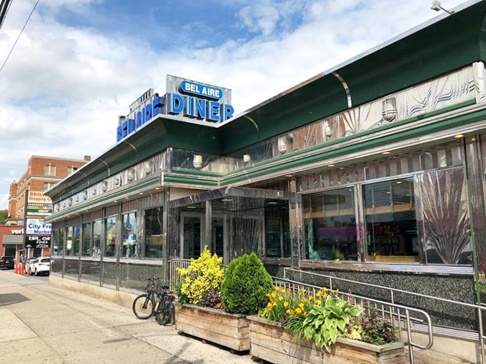 Classic diner architecture that practically screams "Your diet starts tomorrow" because no one regrets pancakes from this Astoria landmark.