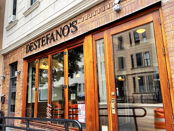 Those wooden doors at DeStefano's might as well be portals to a time when steakhouses were temples and servers were priests.