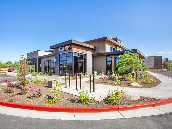 Desert landscaping meets modern design at Firebirds. A temple to flame-kissed perfection where every steak tells a story.