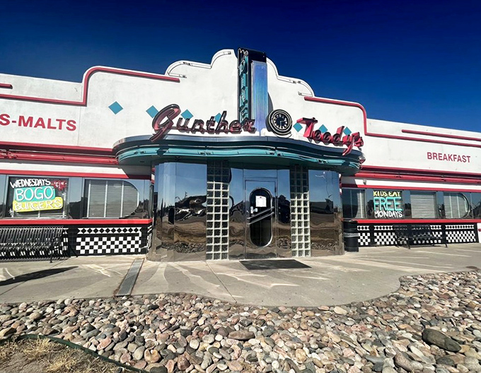 That classic diner architecture practically hums "Rock Around the Clock" while promising milkshakes that require two hands.