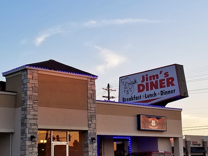 Evening lights give Jim's Diner a welcoming glow &ndash; like a lighthouse guiding hungry travelers to pancake paradise.