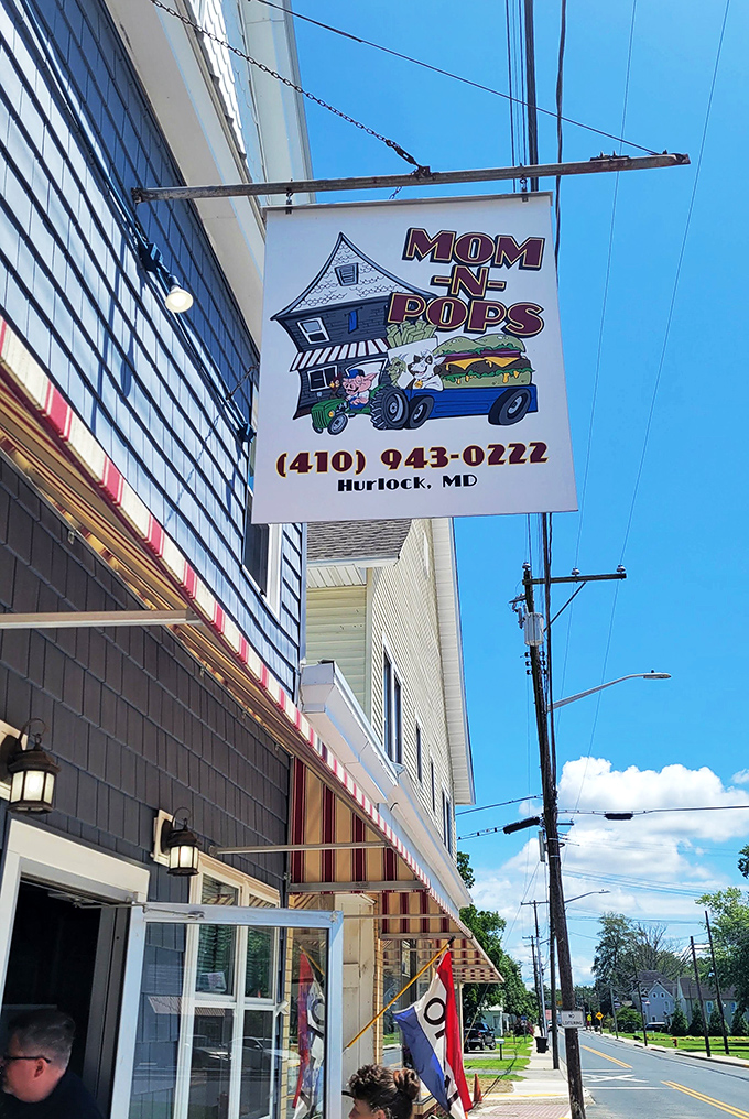 The charming hanging sign featuring a cartoon house and burger tells you everything you need to know: you're about to eat at home.
