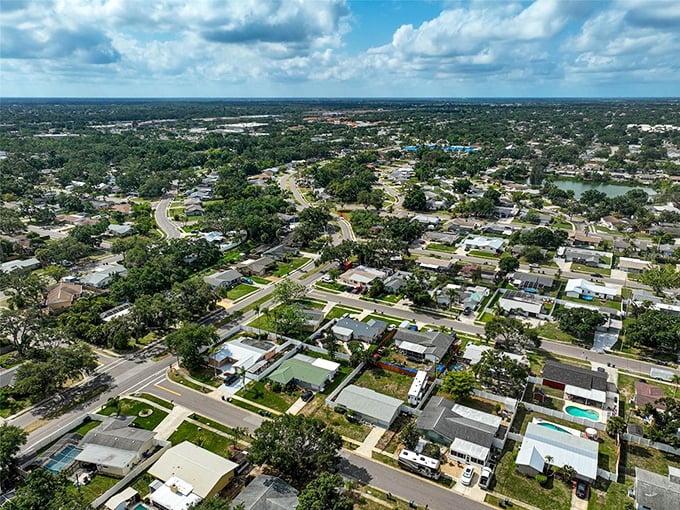 The view from above reveals Sarasota's perfect blend of community planning and natural beauty, where cul-de-sacs become extended families.