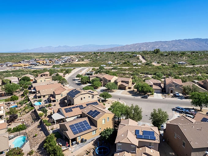 Solar panels dot Vail's rooftops, harnessing Arizona's famous sunshine while mountain views remind residents why they chose desert living.