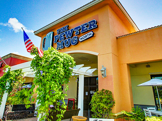 The warm terracotta exterior of The Pewter Mug North stands as Naples' worst-kept secret, where prime rib enthusiasts make their pilgrimage beneath that iconic pewter mug sign.