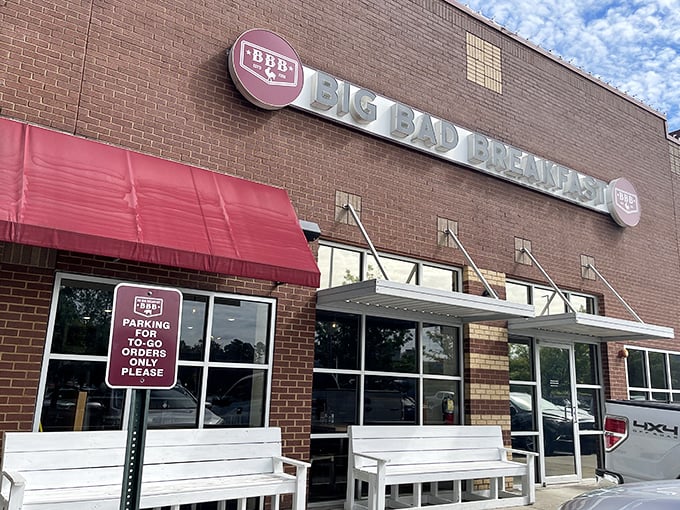 The brick fortress of breakfast dreams announces itself with that bold red awning. Big Bad Breakfast isn't whispering its presence&mdash;it's shouting delicious promises.
