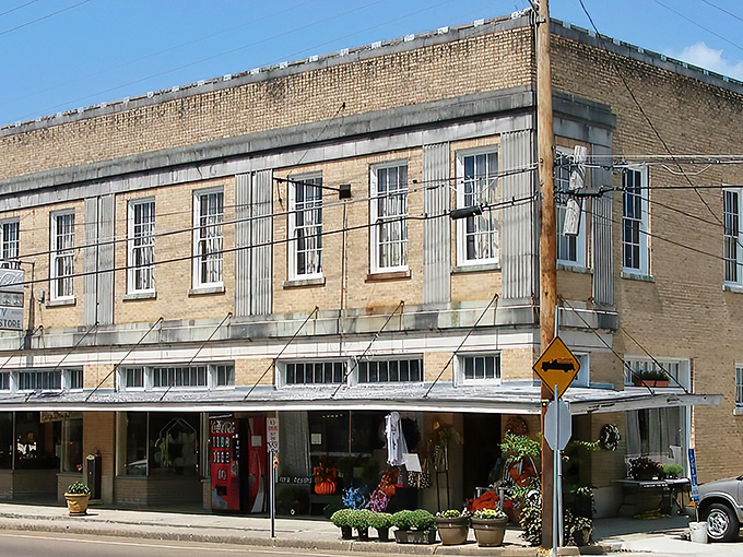 Woodville's historic Main Street welcomes visitors with its timeless charm, where brick buildings and covered walkways tell stories of Mississippi's past.
