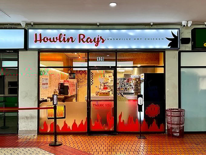The fiery entrance to Howlin' Ray's beckons brave souls with its flame-adorned doors. This isn't just dinner—it's a delicious dare.
