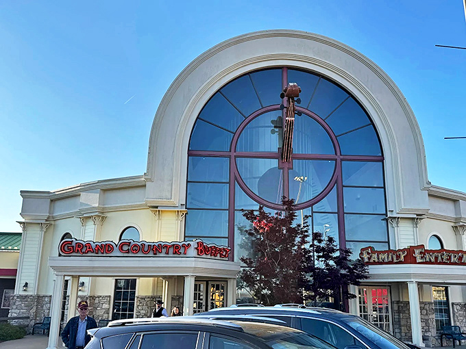 The grand arched entrance to Grand Country Buffet stands like a cathedral to comfort food, beckoning hungry pilgrims with its promise of abundance.
