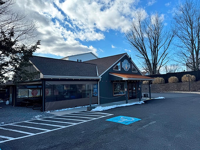 The unassuming blue exterior of Jesse's Barbecue hides culinary treasures within&mdash;like finding a diamond mine disguised as a garden shed.