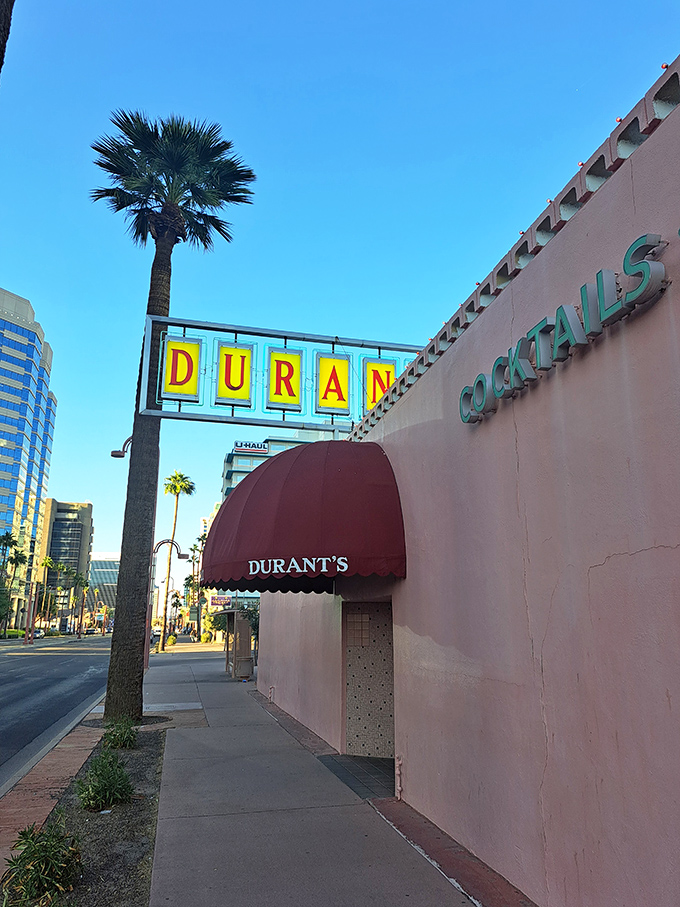 The iconic pink exterior of Durant's stands proudly on Central Avenue, a mid-century mirage in downtown Phoenix's urban landscape.
