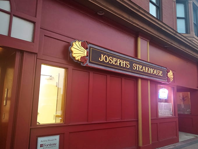 The unassuming brick façade of Joseph's Steakhouse hides culinary greatness like Clark Kent's glasses hide Superman. Classic signage promises old-school excellence.