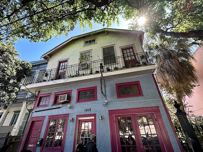 The pink-trimmed facade of Surrey's stands out on Magazine Street like a culinary beacon, promising breakfast treasures within those colorful walls.
