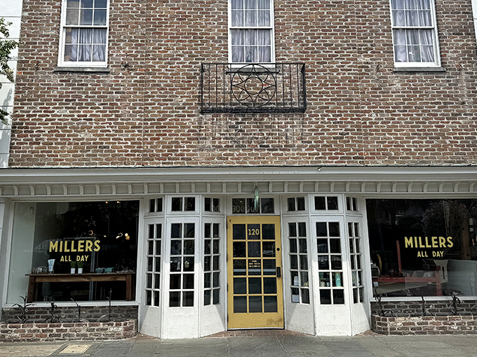 A glimpse of paradise through paned windows&mdash;Millers All Day's inviting exterior promises breakfast bliss behind that cheerful yellow door.