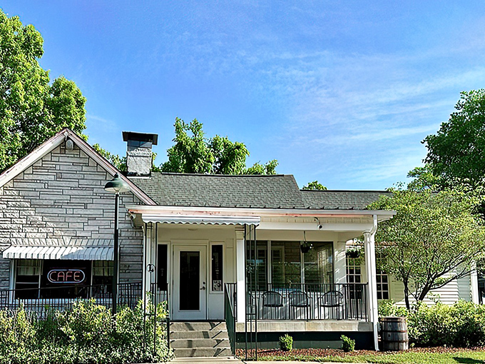 The humble stone facade of Loveless Cafe stands like a time capsule of Southern hospitality, promising comfort food treasures within its welcoming porch.