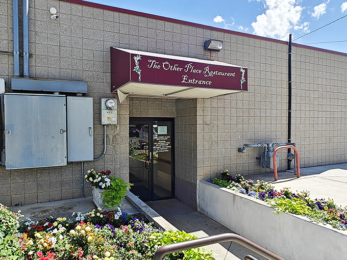 The unassuming exterior of The Other Place Restaurant proves that culinary treasures often hide behind modest facades. Greek greatness awaits inside! 