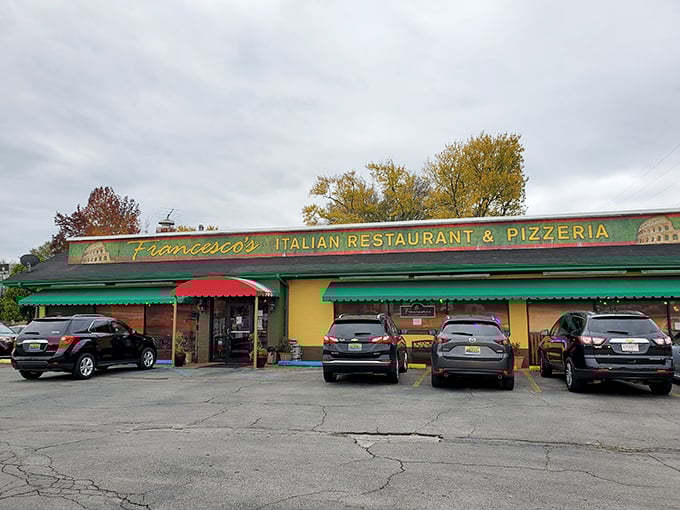 The cheerful yellow exterior with its red and green awnings isn't just inviting&mdash;it's practically shouting "authentic Italian food inside!" like a culinary town crier.