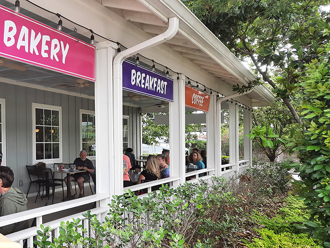 The unassuming exterior of BuzzCatz with its cheerful purple door promises culinary treasures within. Like finding a diamond in a beach town—this place delivers.