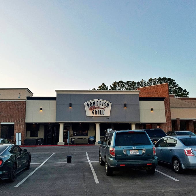 The iconic Bonefish Grill facade stands like a beacon for seafood lovers, its distinctive fish skeleton sign promising aquatic delights within.