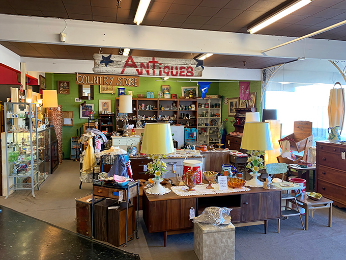 The unassuming exterior of Antique Trove hides a universe of treasures within, like finding a portal to the past disguised as a strip mall storefront.