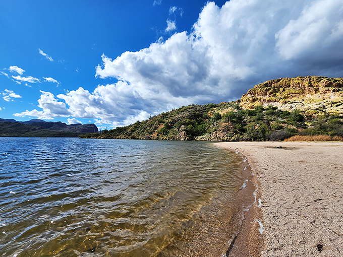 Where desert meets shoreline in a geographical plot twist that would make M. Night Shyamalan jealous. Arizona's secret beach beckons with crystalline waters and rugged mountain backdrops.