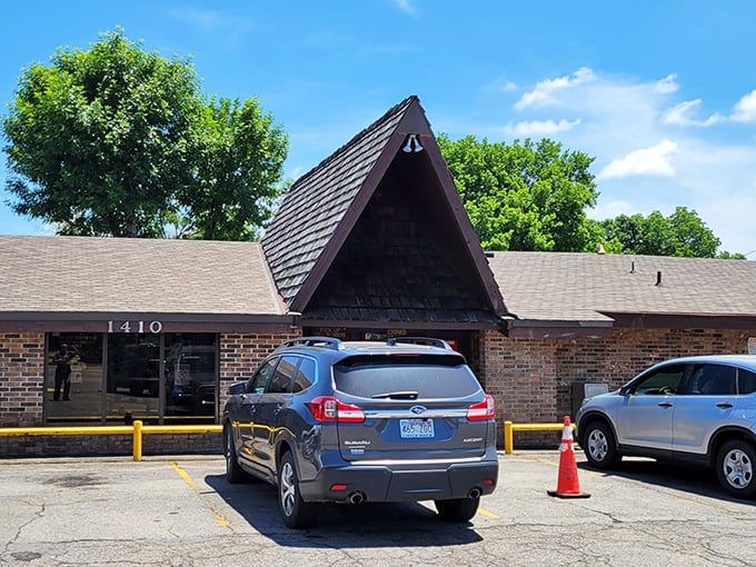 The unassuming A-frame entrance of Feltner's Whatta-Burger stands like a burger beacon in Russellville, promising no-frills deliciousness inside.
