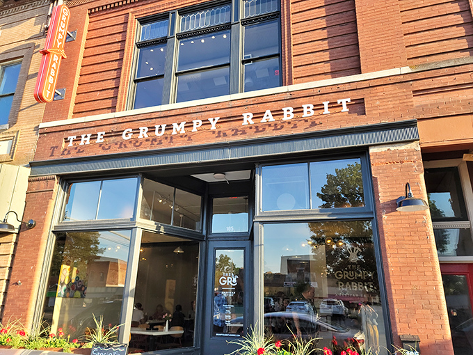 The historic brick facade of The Grumpy Rabbit stands proudly on Lonoke's main street, promising culinary adventures behind those welcoming windows.