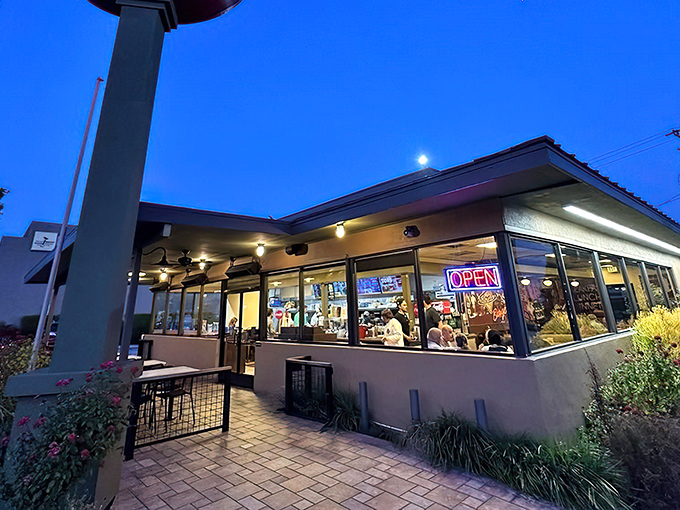 The iconic Tops Drive In glows with warm promise at dusk, a beacon for hungry Pasadenans seeking comfort food after sundown.