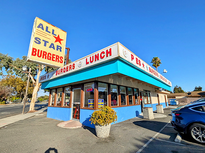 That turquoise trim isn't just eye-catching&mdash;it's a beacon of burger hope on the Newark horizon. The vintage sign promises simple pleasures done right.