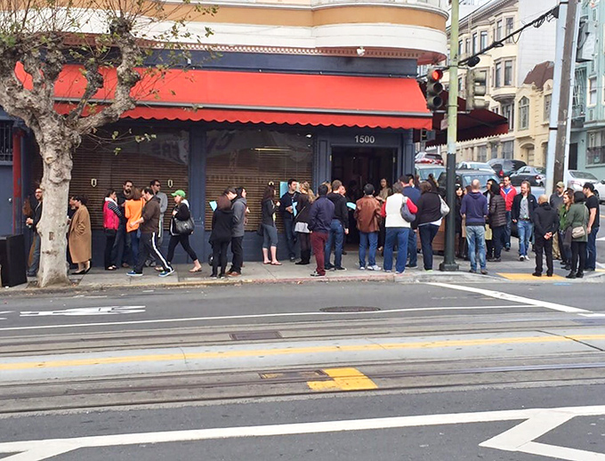 The red awning and line stretching down the block tells you everything &ndash; this isn't just breakfast, it's an event worth waiting for.