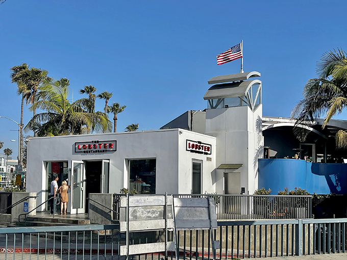 The pristine white exterior of The Lobster beckons seafood lovers at the entrance to Santa Monica Pier, promising oceanic delights with unbeatable views.