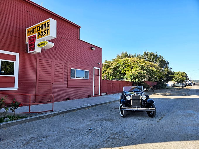 The red exterior of The Hitching Post stands like a culinary lighthouse in Casmalia, beckoning hungry travelers with promises of smoky perfection.