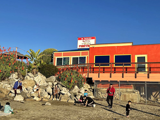 The bright orange beacon of Barbara's Fishtrap stands proudly against the California blue sky, promising seafood treasures to those who make the coastal pilgrimage.