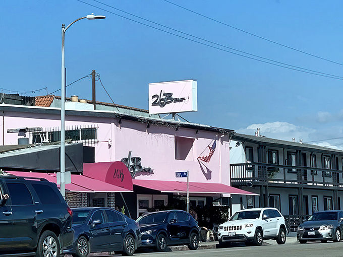 The iconic pink awning of 26 Beach welcomes you with a cheerful "Oh happy day!" message. Self-care starts here, one French toast at a time.
